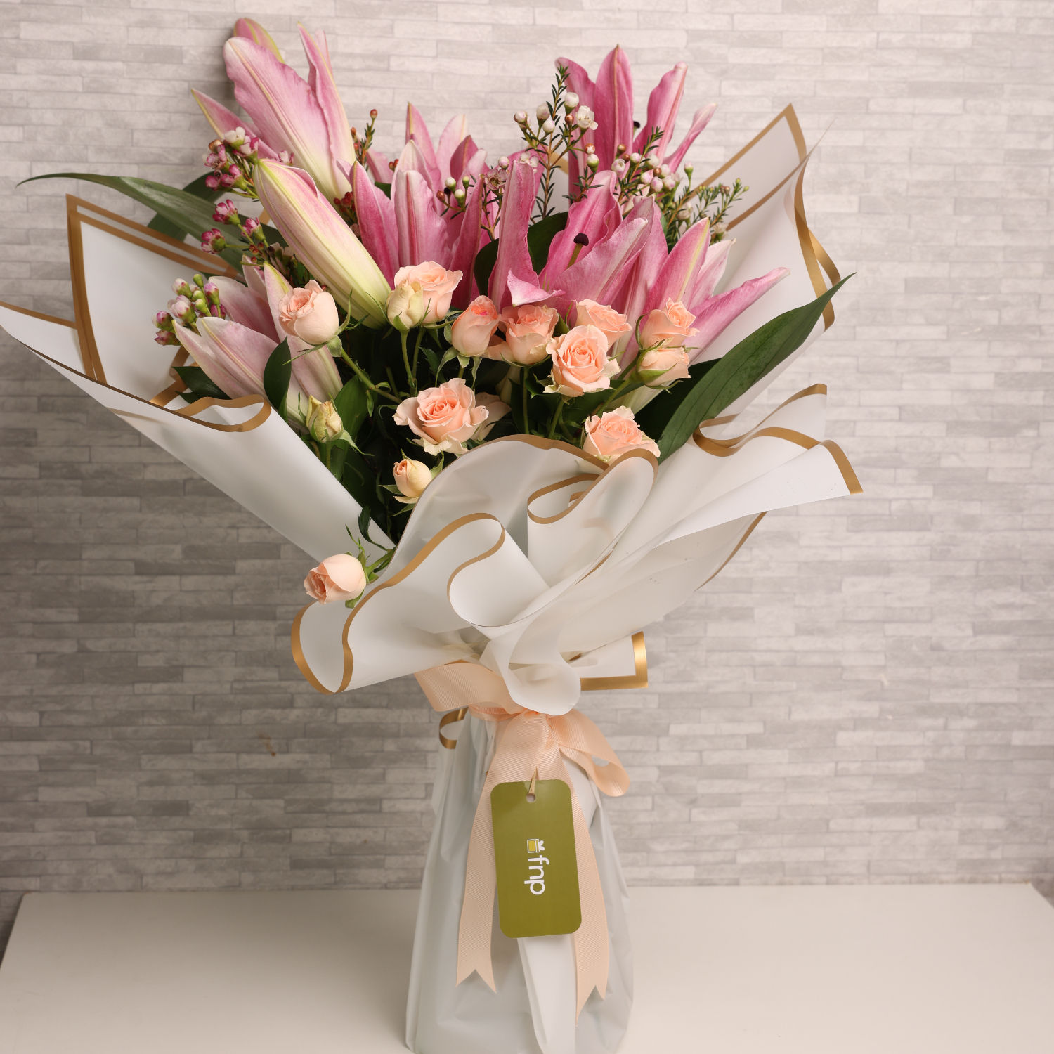 Online Lily Hand Bouquet Gift Delivery in Qatar - FNP